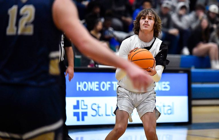 BOYS BASKETBALL: Trojans finish on top in see-saw battle with ...