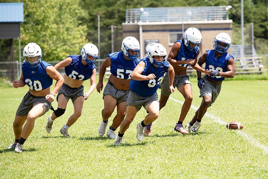 FOOTBALL: Wolverines roll into opening day of preseason practice | The ...